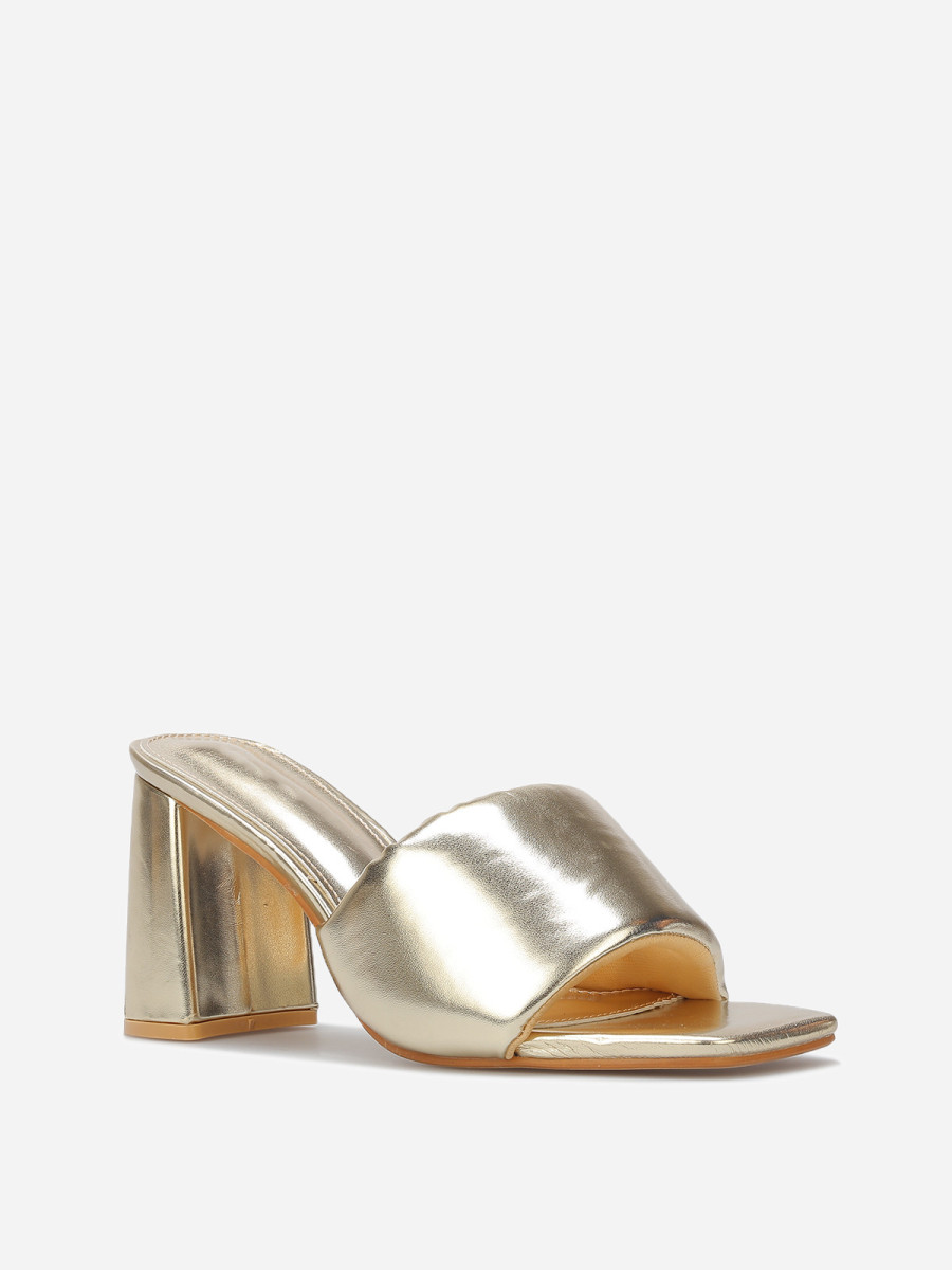 Mules à talon et bride rembourrée